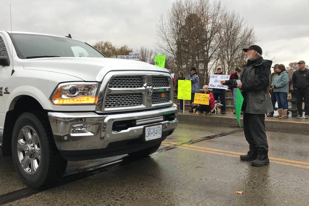 Grand Forks residents protest on bridge to call for ‘fair’ compensation ...